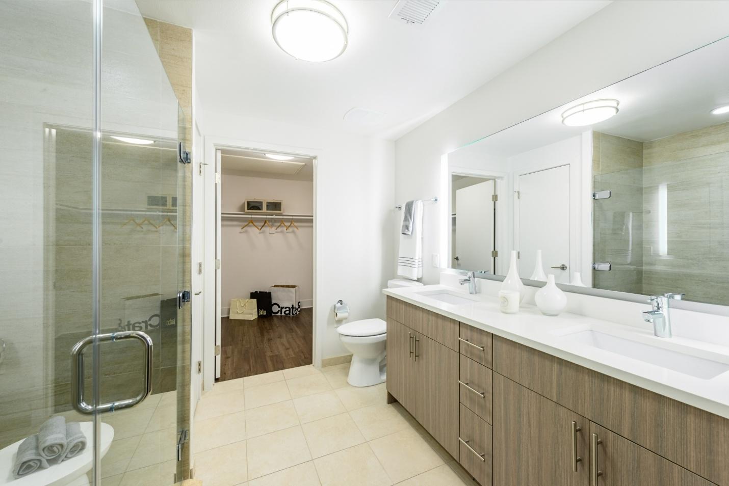 Walk-in shower, walk-in closets*, and dual bathroom sinks* - Runway Living